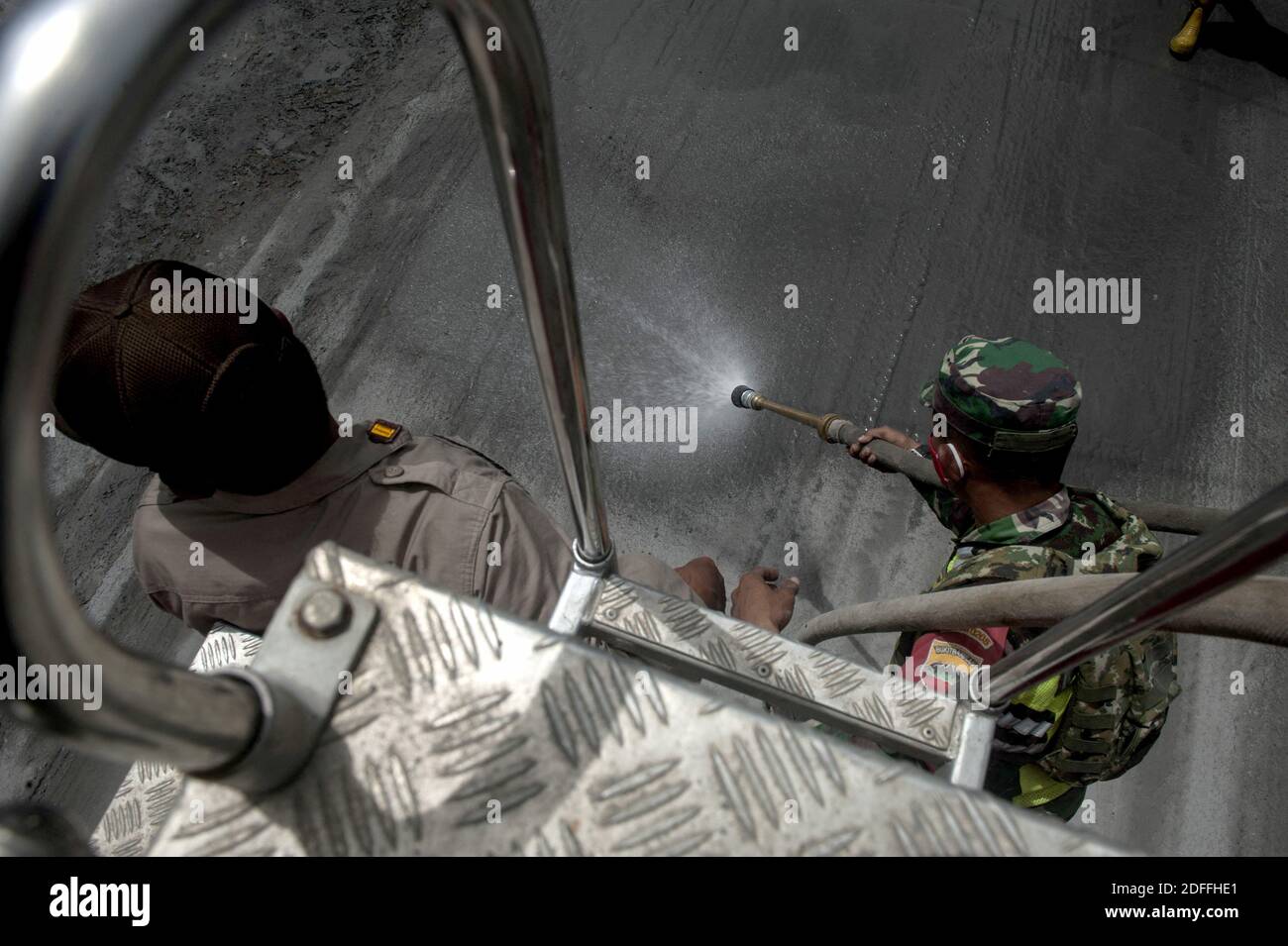 Cleaning volcano ash hi-res stock photography and images - Alamy