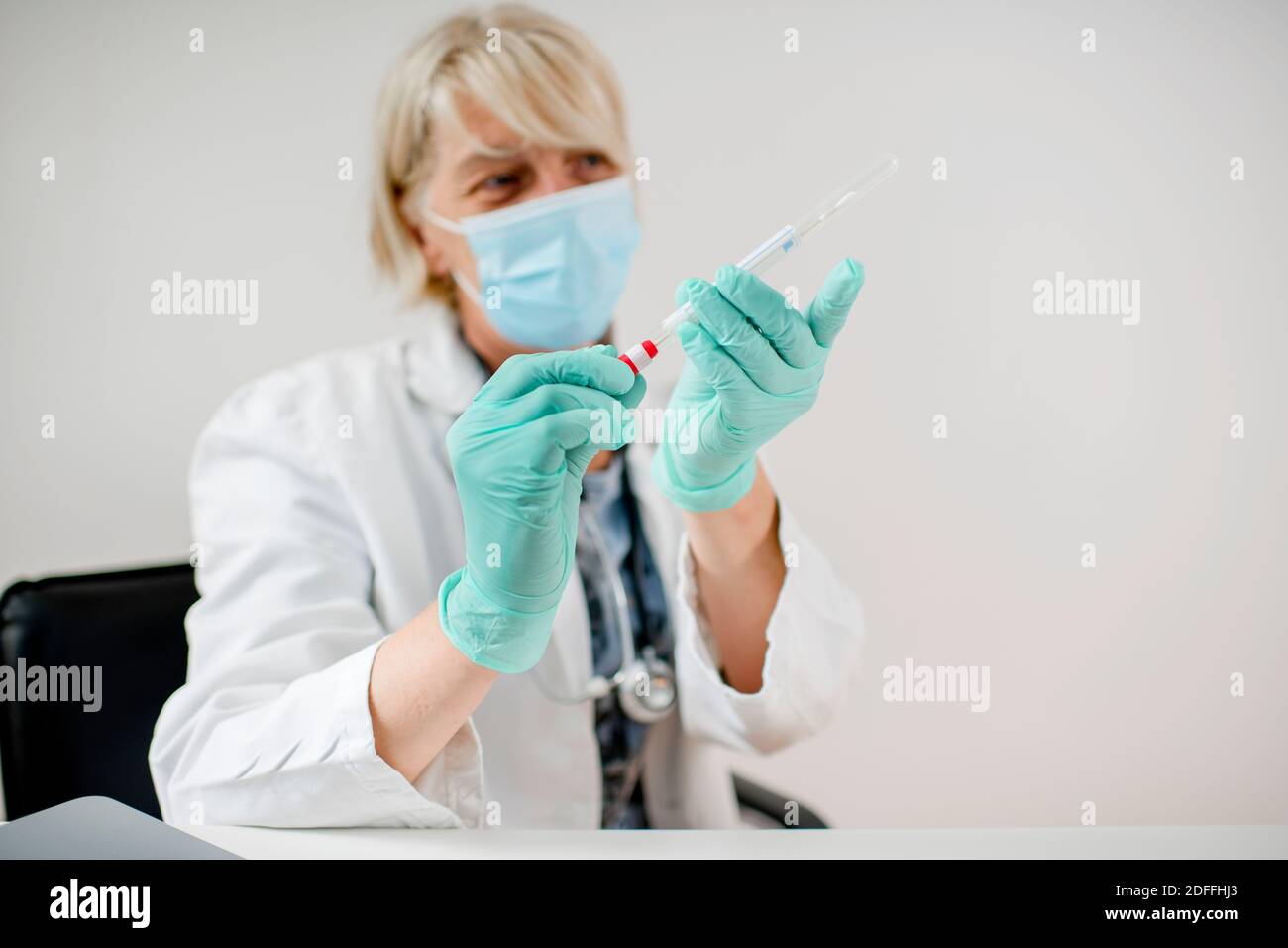 Female doctor preparing cotton swab Stock Photo - Alamy