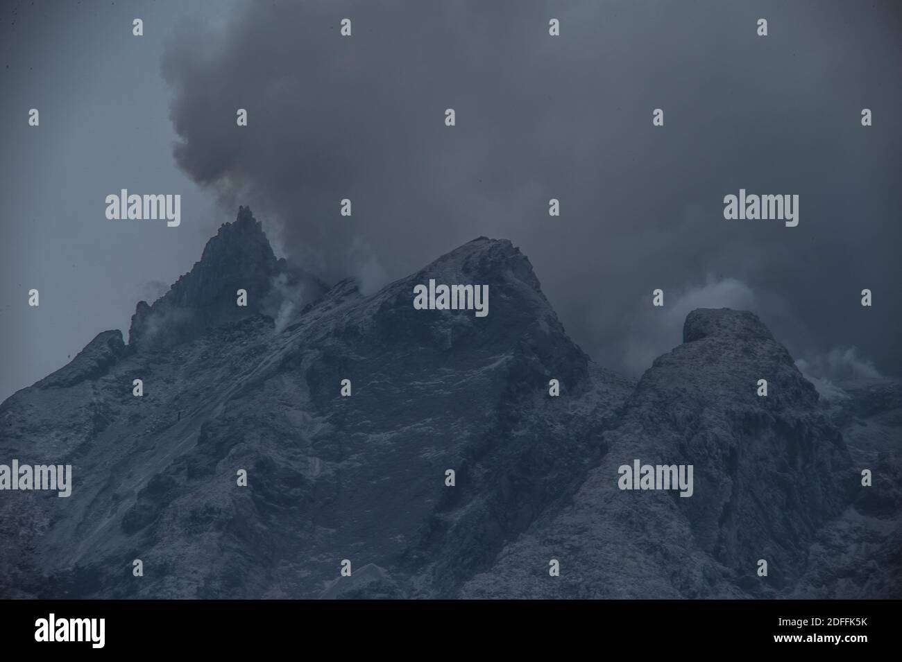 The crater of Sinabung volcano seen covered by volcanic ash after ...