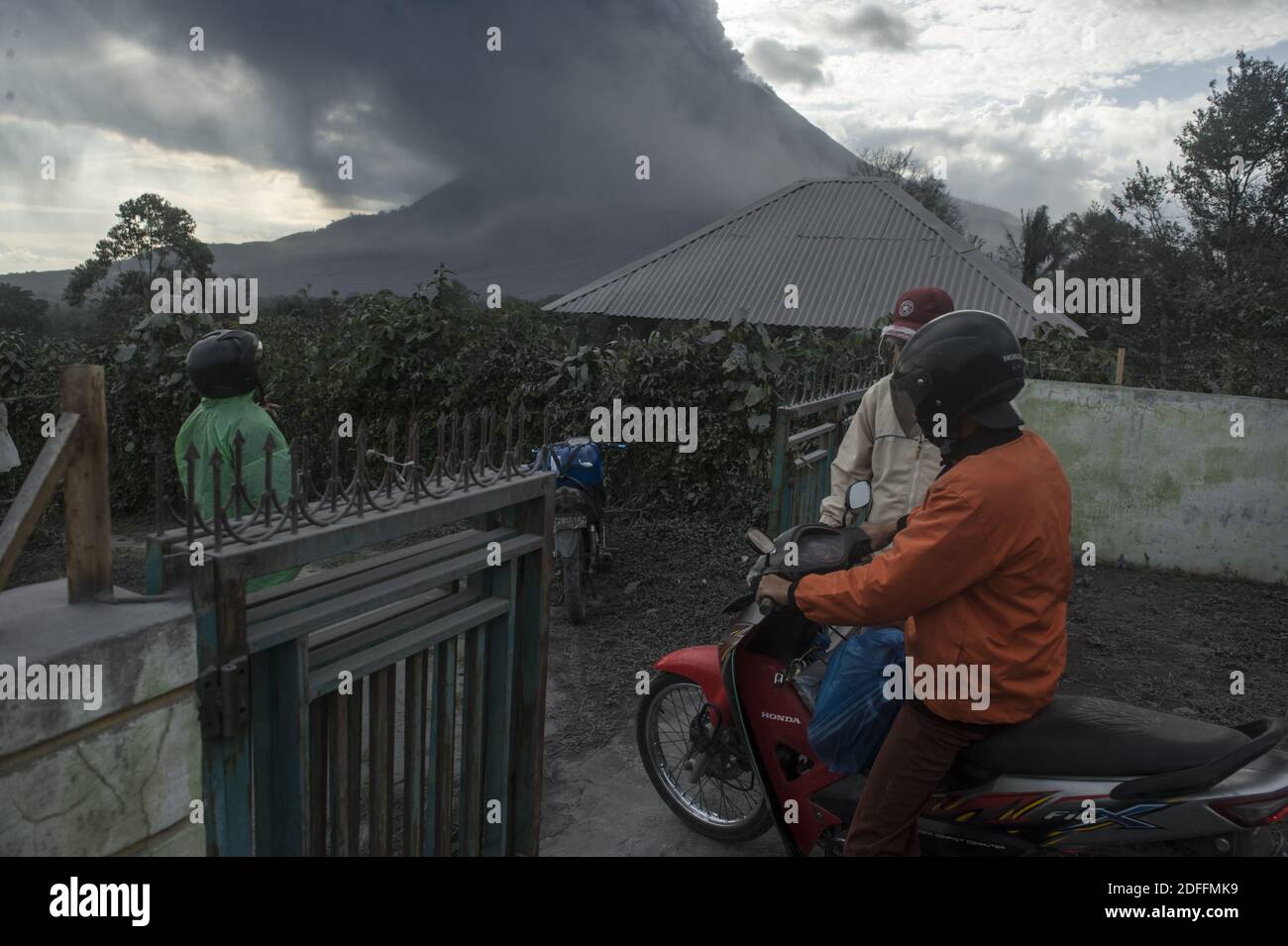 A residents seen using mask while riding by motorbike while Sinabung ...
