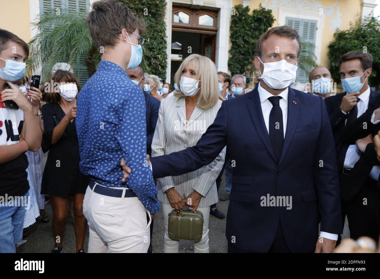 French President Emmanuel Macron, along with his wife Brigitte Macron ...