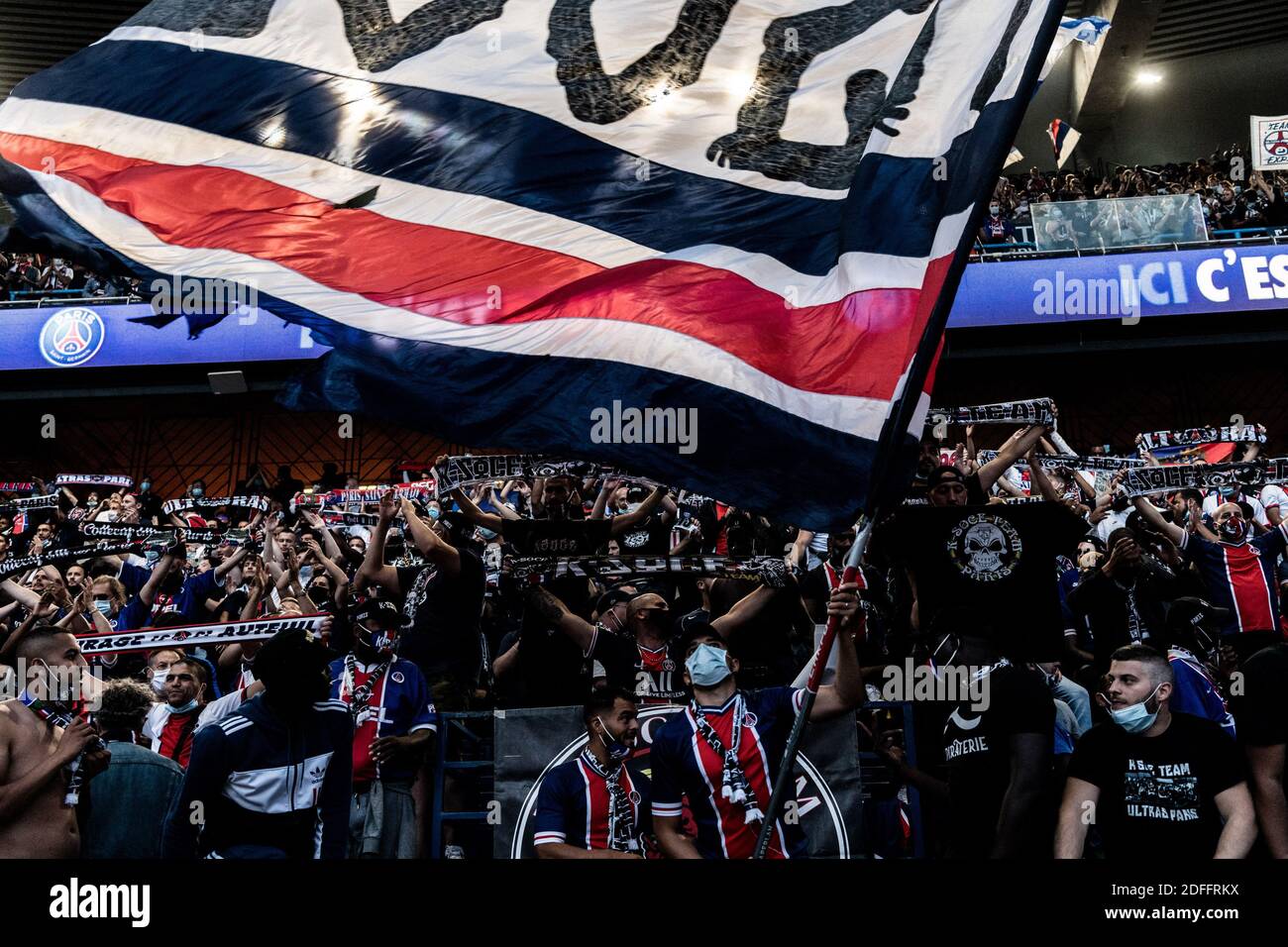 Paris Saint-Germain (PSG) supporters cheer for their team as they watch ...