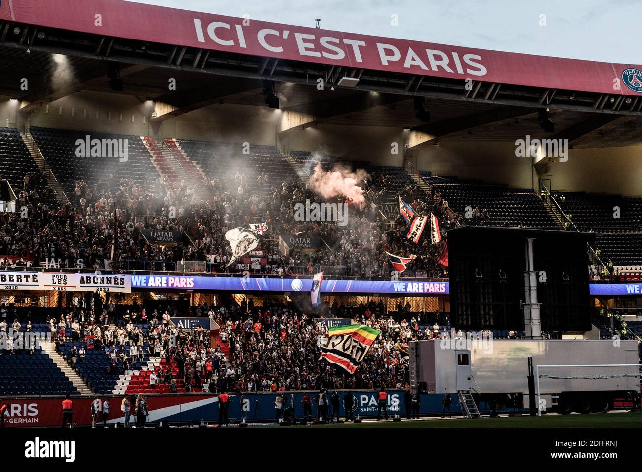 Paris Saint-Germain (PSG) supporters cheer for their team as they watch ...
