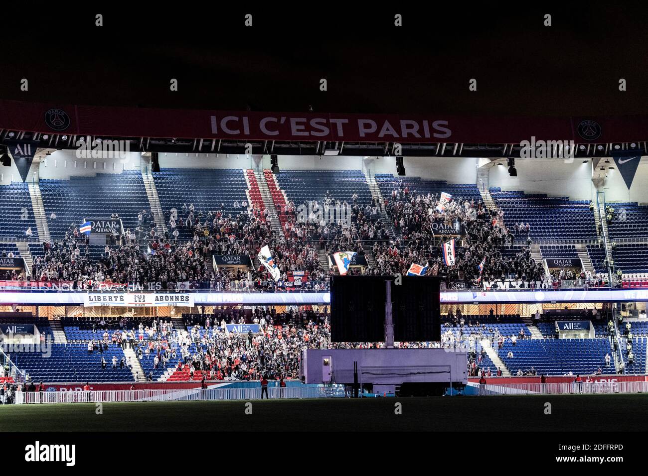 Paris Saint-Germain (PSG) supporters cheer for their team as they watch ...