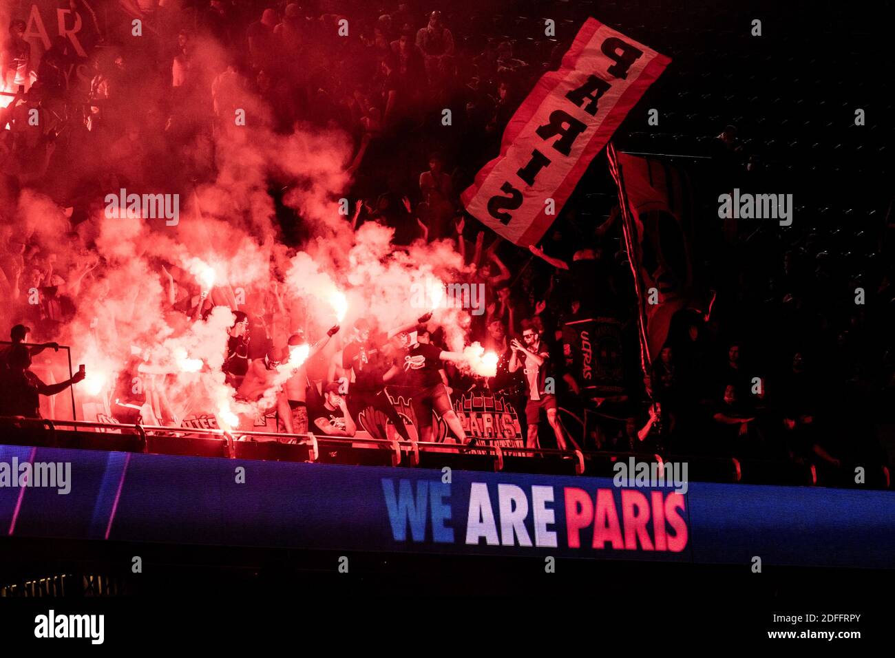 Paris Saint-Germain (PSG) supporters cheer for their team as they watch ...