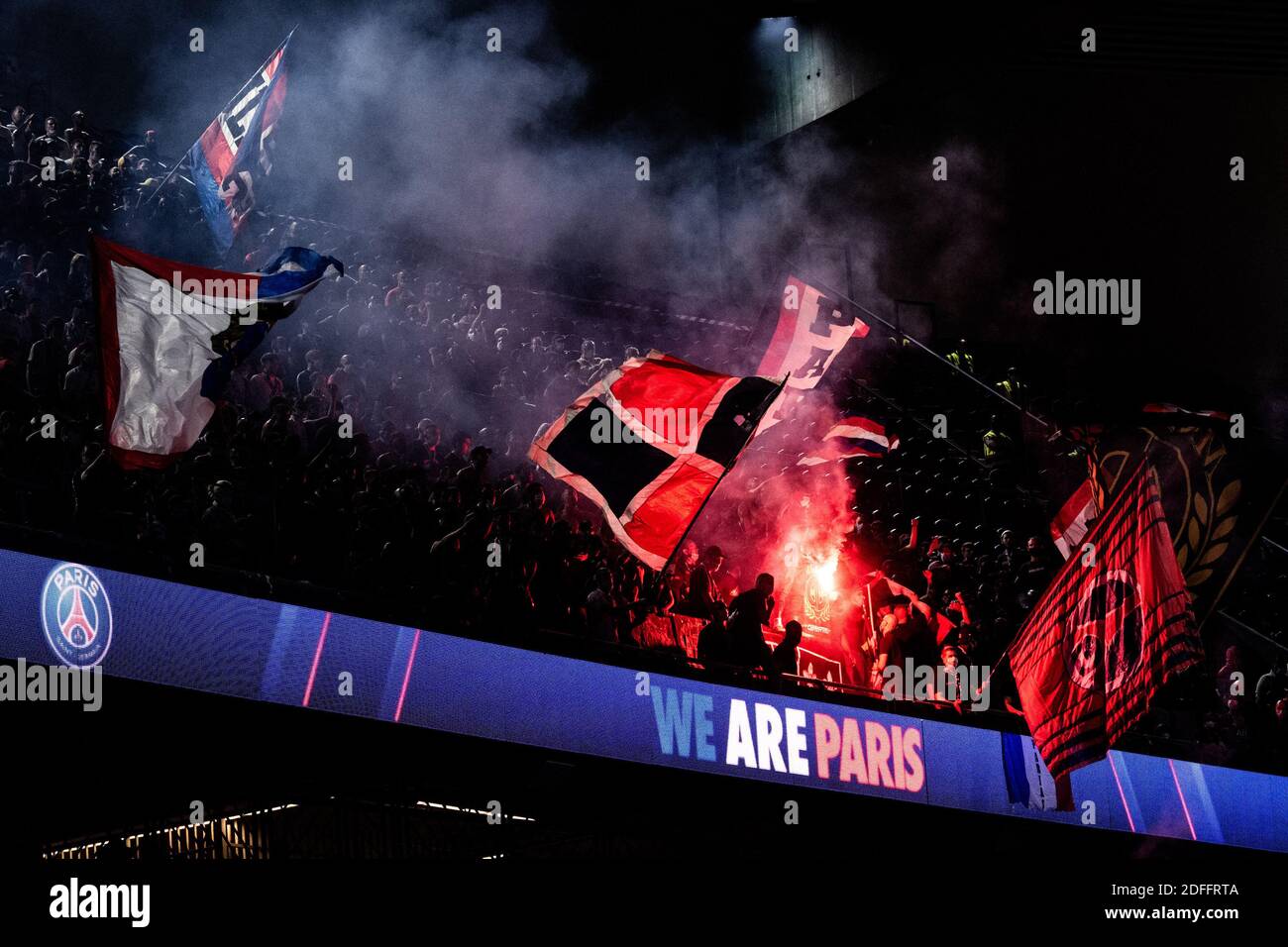 Paris Saint-Germain (PSG) supporters cheer for their team as they watch ...