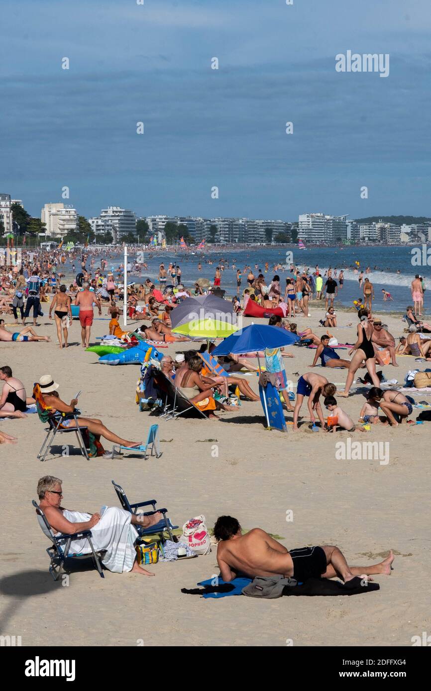 People sunbathe at the Benoit beach in La Baule, France on August 20 ...