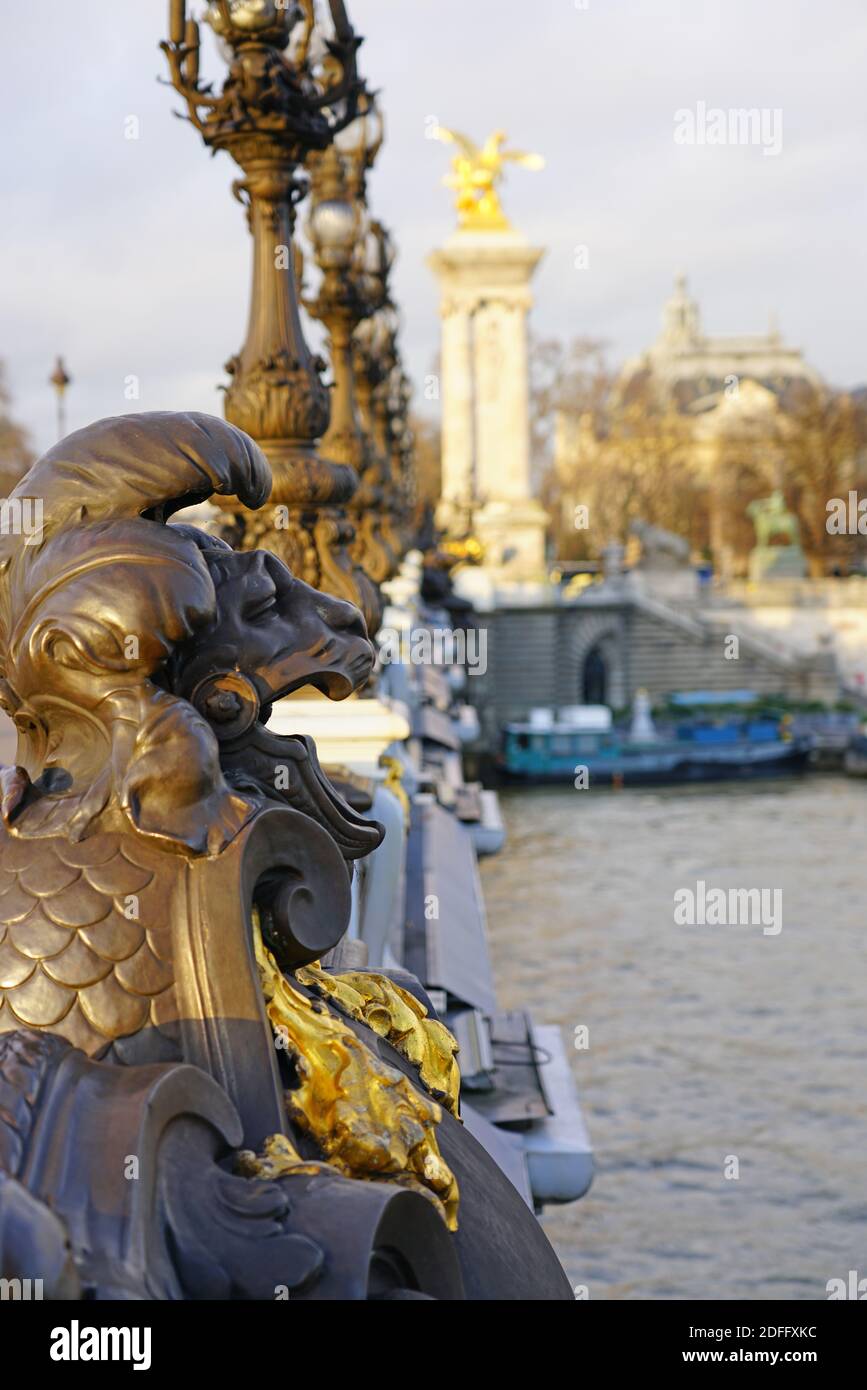 PARIS, FRANCE -20 DEC 2019- Ornate black and gold statues on the Pont ...
