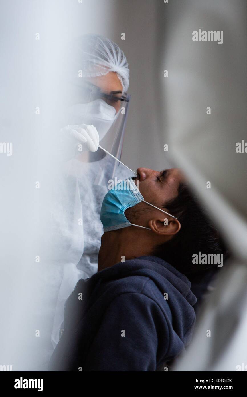 Nurses and doctors perform PCR tests in the laboratory installed in ...