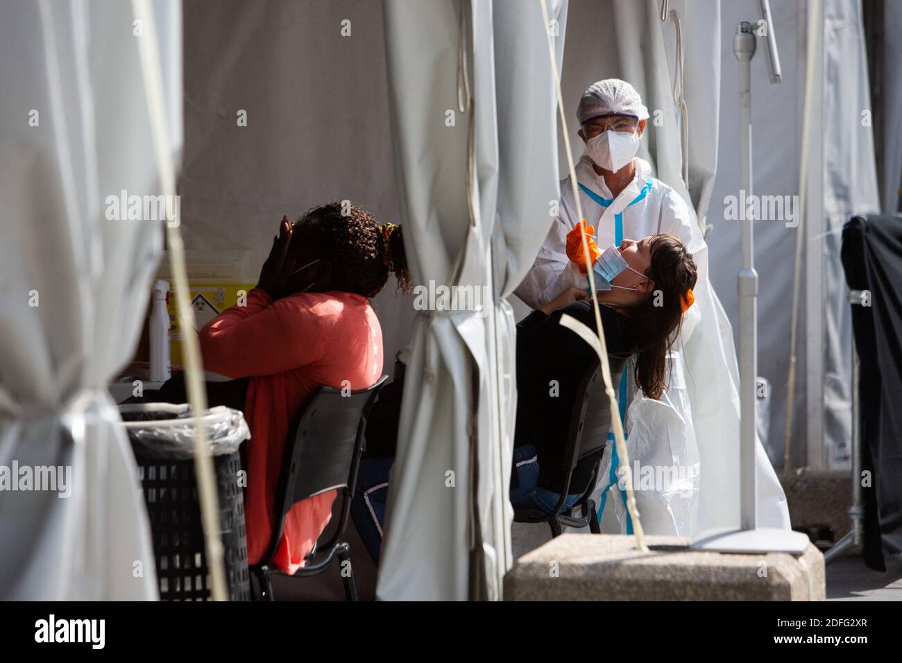 Nurses and doctors perform PCR tests in the laboratory installed in ...
