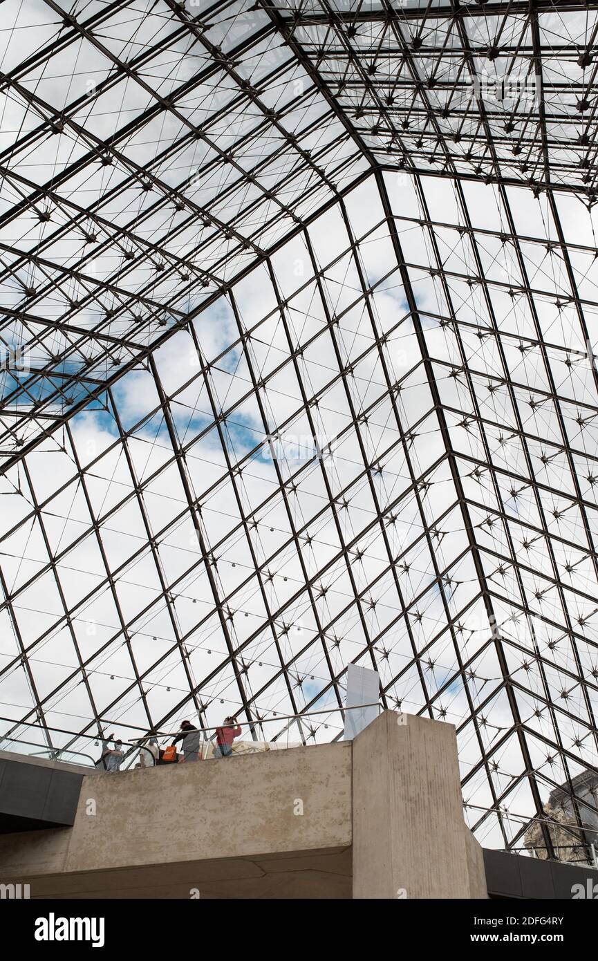 Tourist wearing protective face mask walk in the hall as they visit the ...