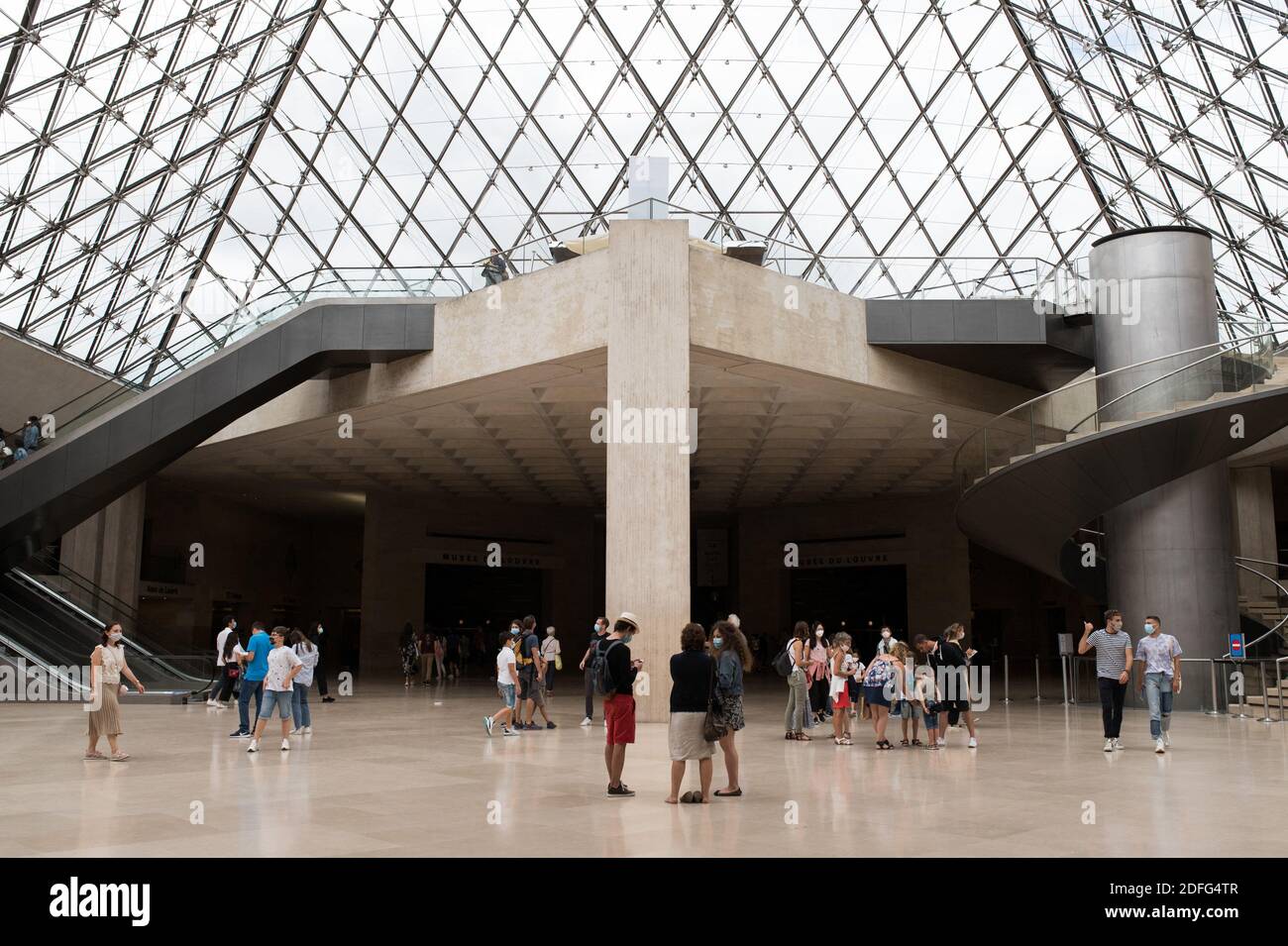 Tourist wearing protective face mask walk in the hall as they visit the ...
