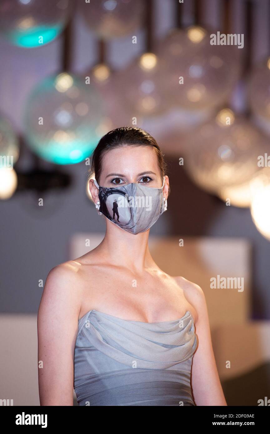A guest wearing a sanitary face mask attending the Mandibules Premiere ...