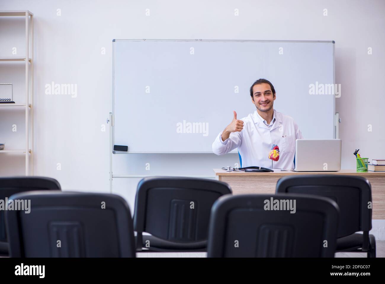 Young doctor giving seminar in the classroom Stock Photo - Alamy