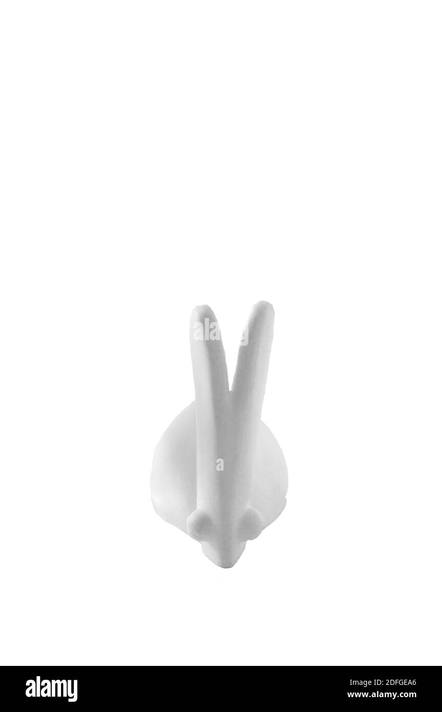 a vertical shot of a gray plastic rabbit on a white background Stock ...