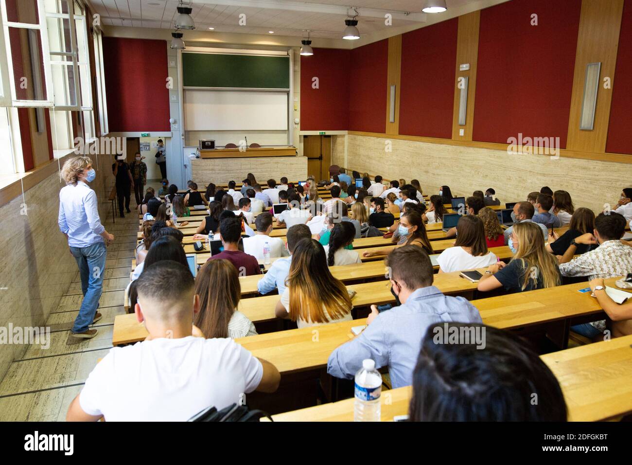 University students wearing face masks in an Amphitheater ...