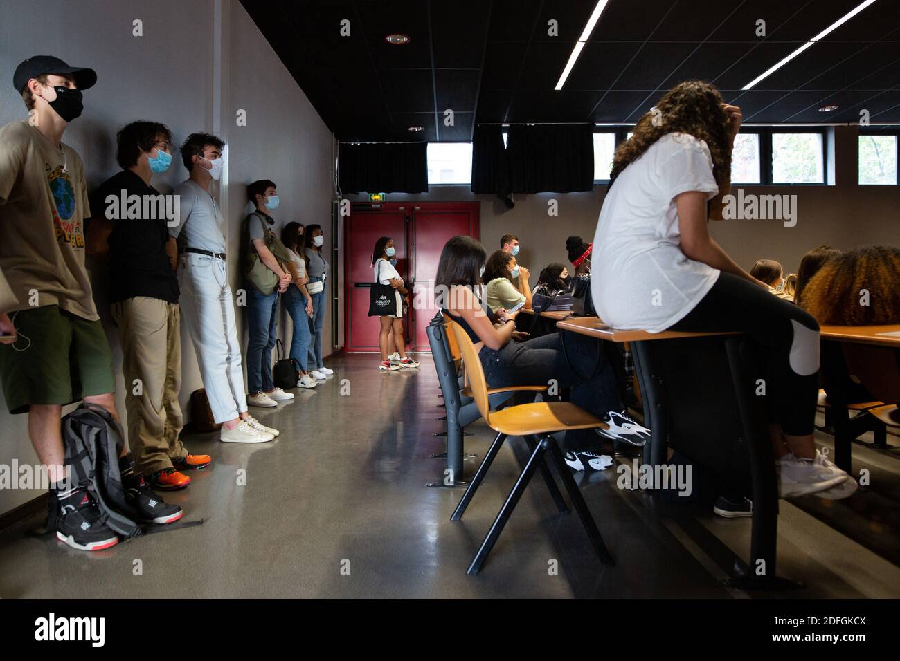 University students wearing face masks in an Amphitheater ...