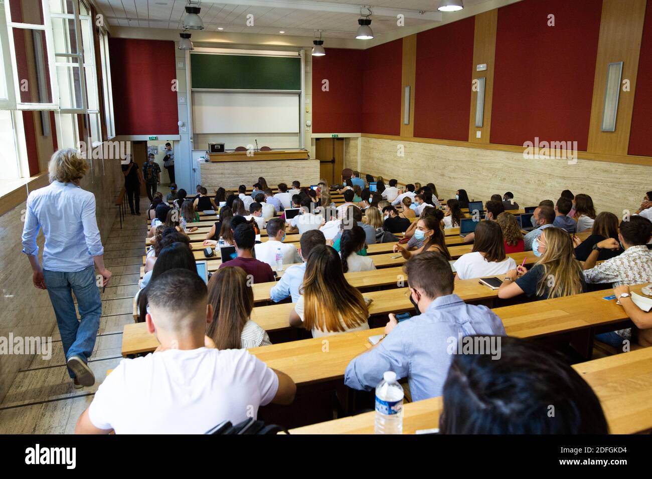 University students wearing face masks in an Amphitheater ...