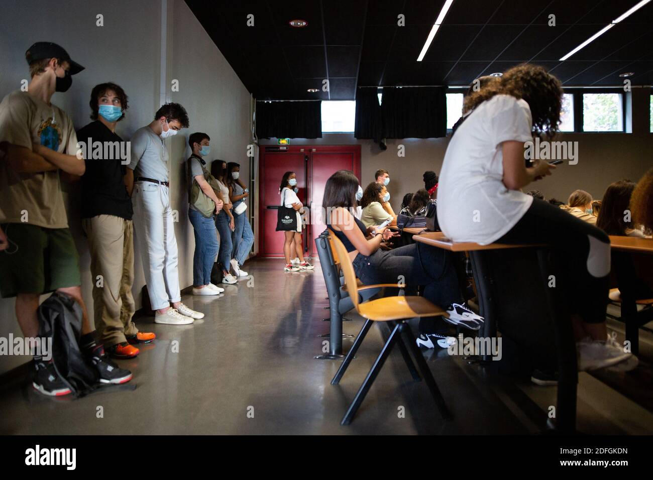 University students wearing face masks in an Amphitheater ...