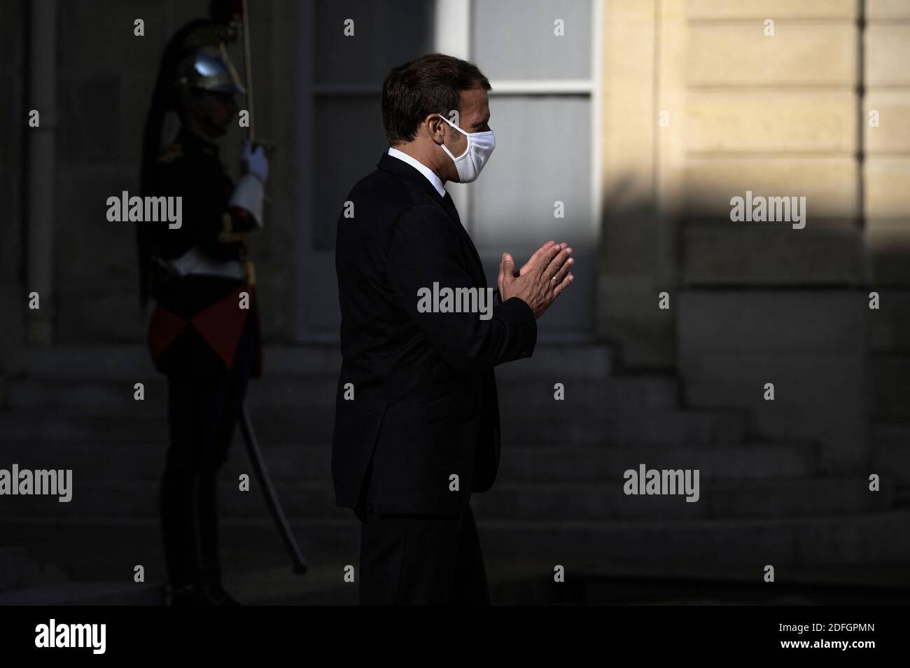French President Emmanuel Macron (R) at the Elysee Palace in Paris ...