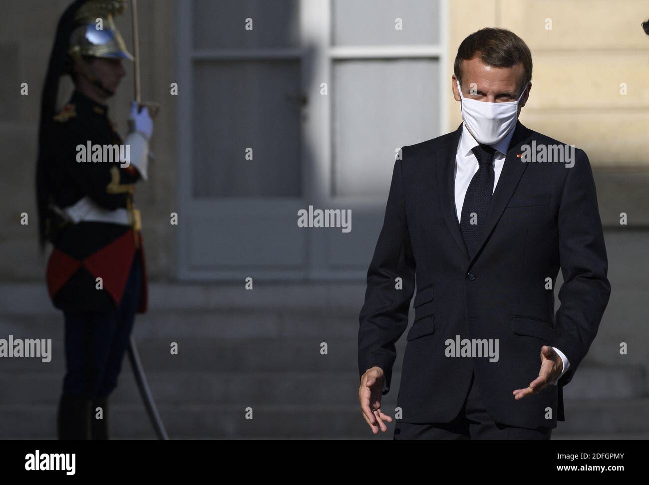 French President Emmanuel Macron (R) at the Elysee Palace in Paris ...