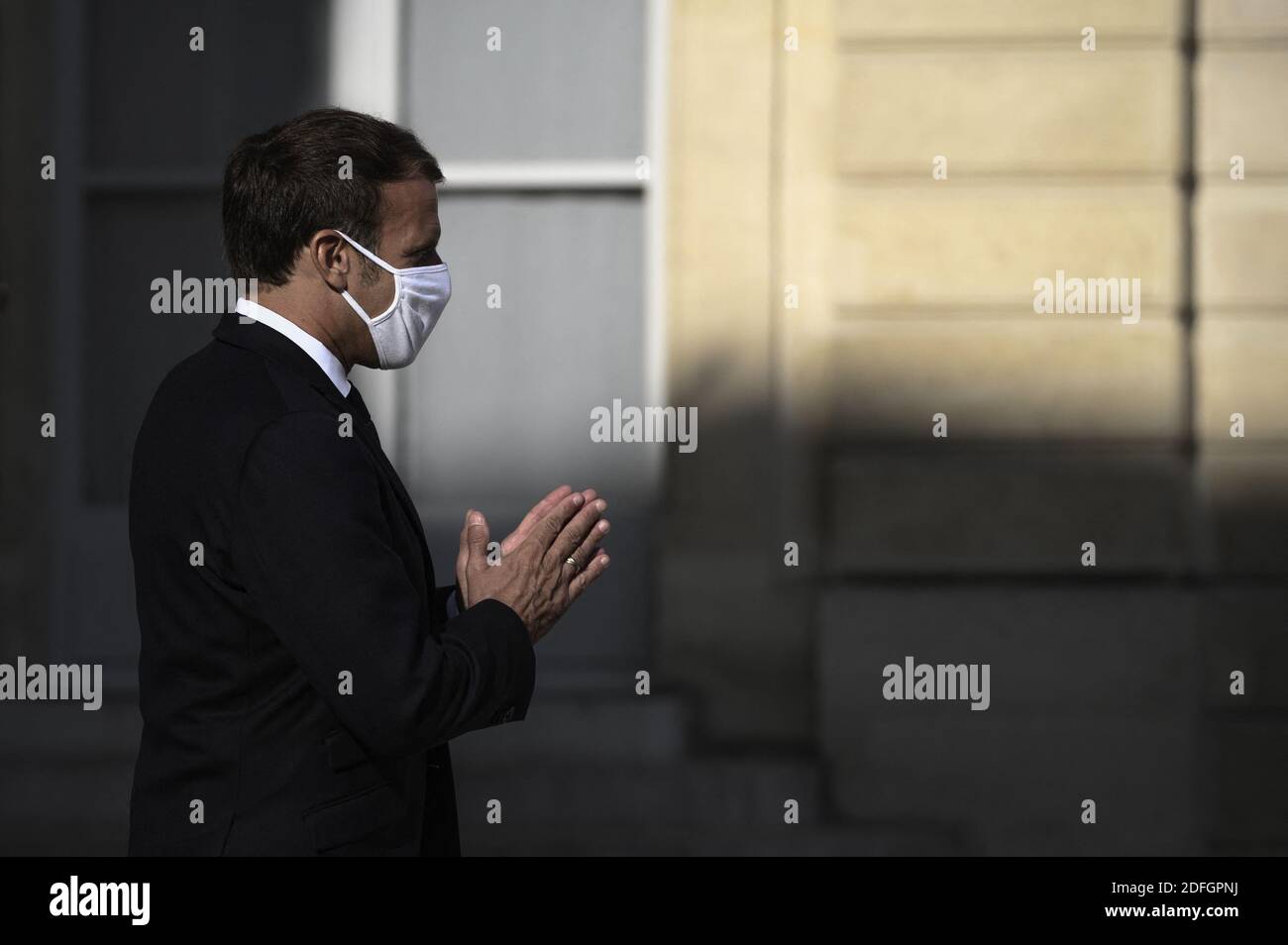 French President Emmanuel Macron (R) at the Elysee Palace in Paris ...