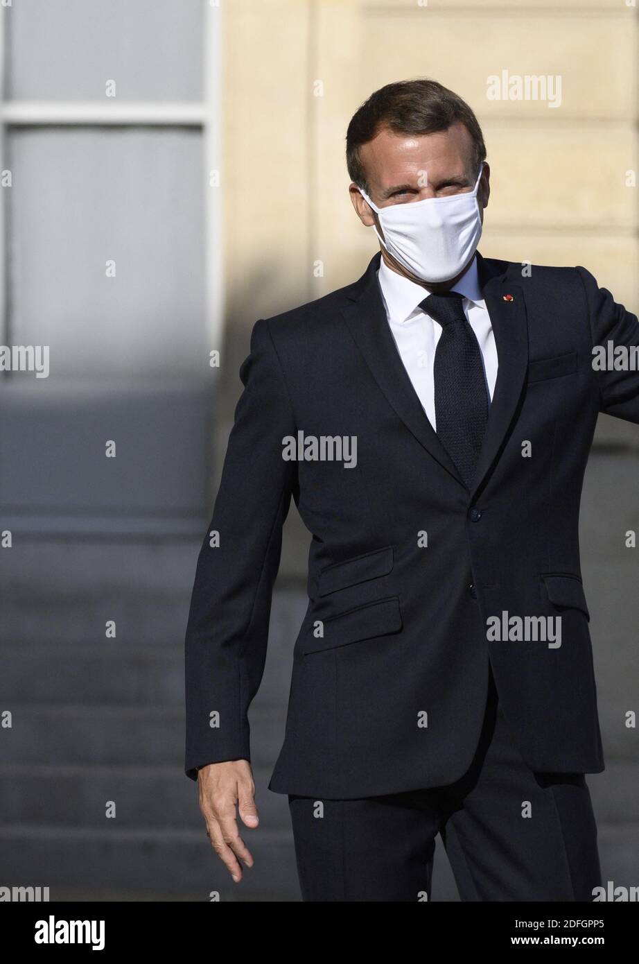 French President Emmanuel Macron (R) at the Elysee Palace in Paris ...