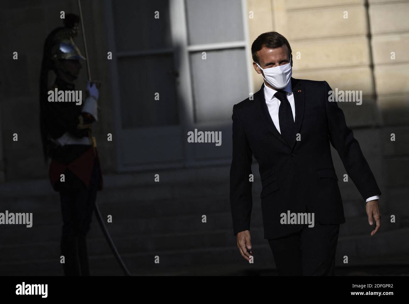 French President Emmanuel Macron (R) at the Elysee Palace in Paris ...