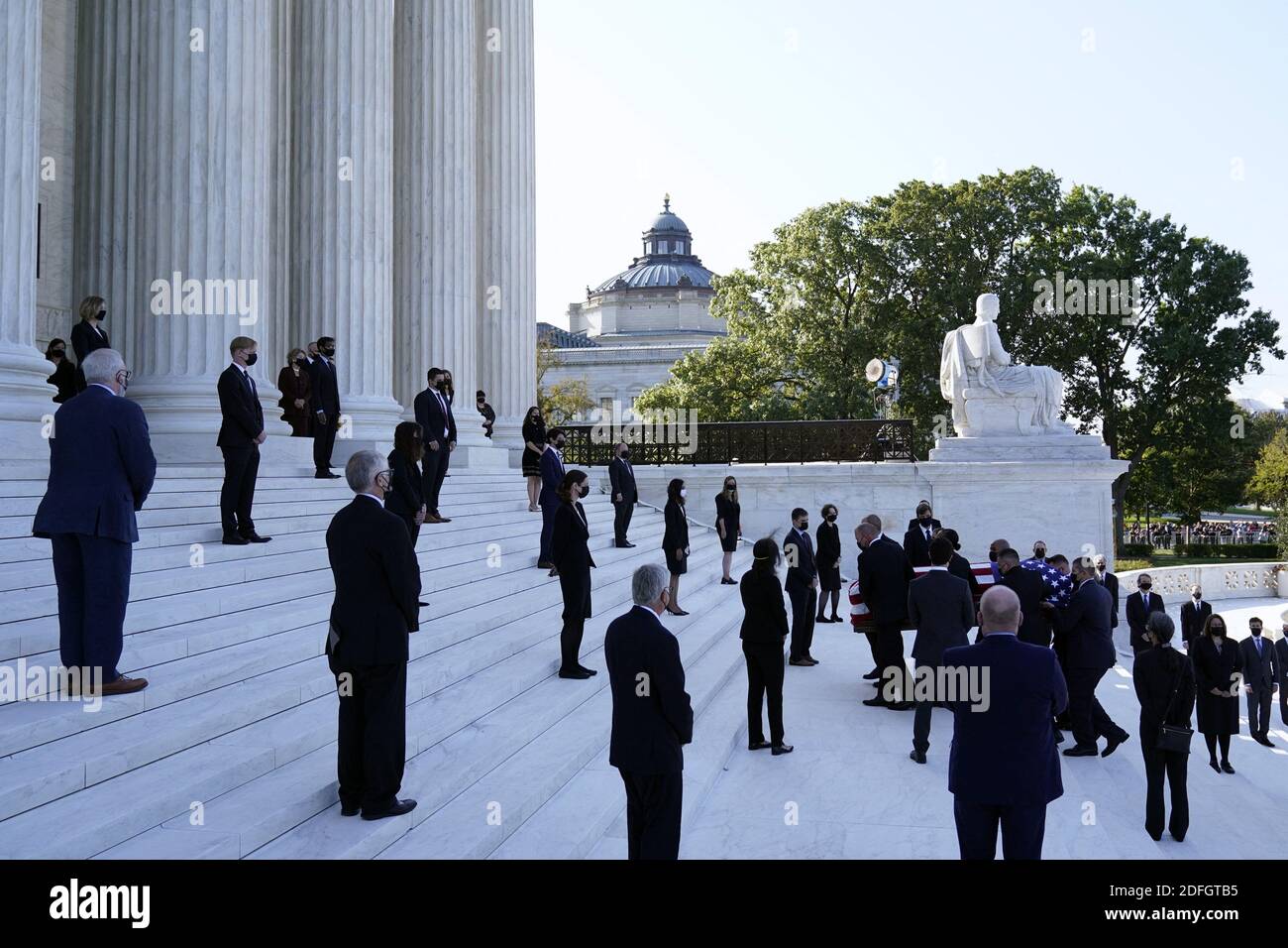 The flag-draped casket of Justice Ruth Bader Ginsburg is carried up the ...