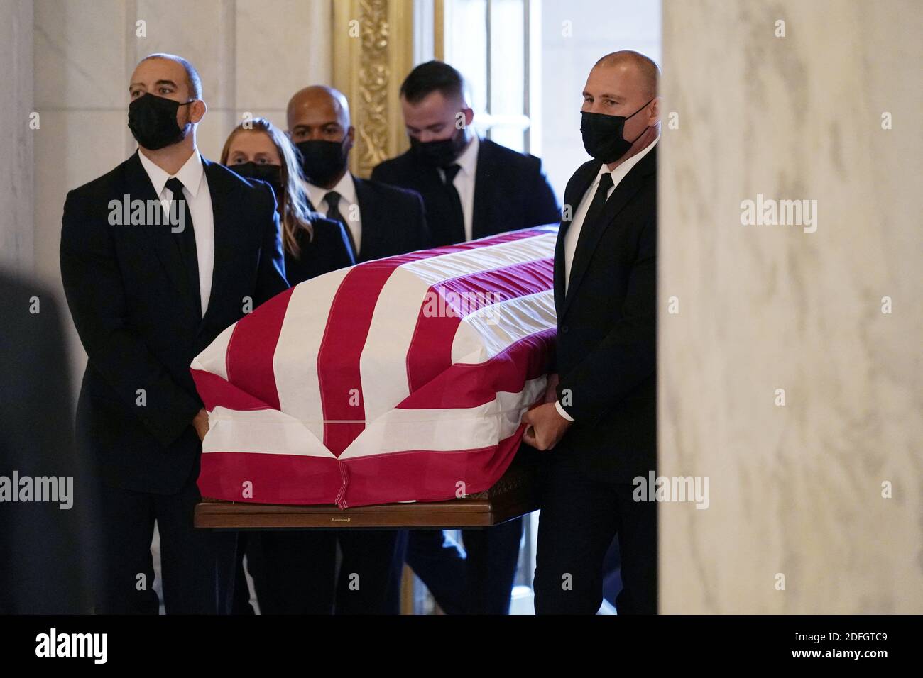 The flag-draped casket of Justice Ruth Bader Ginsburg, carried by ...