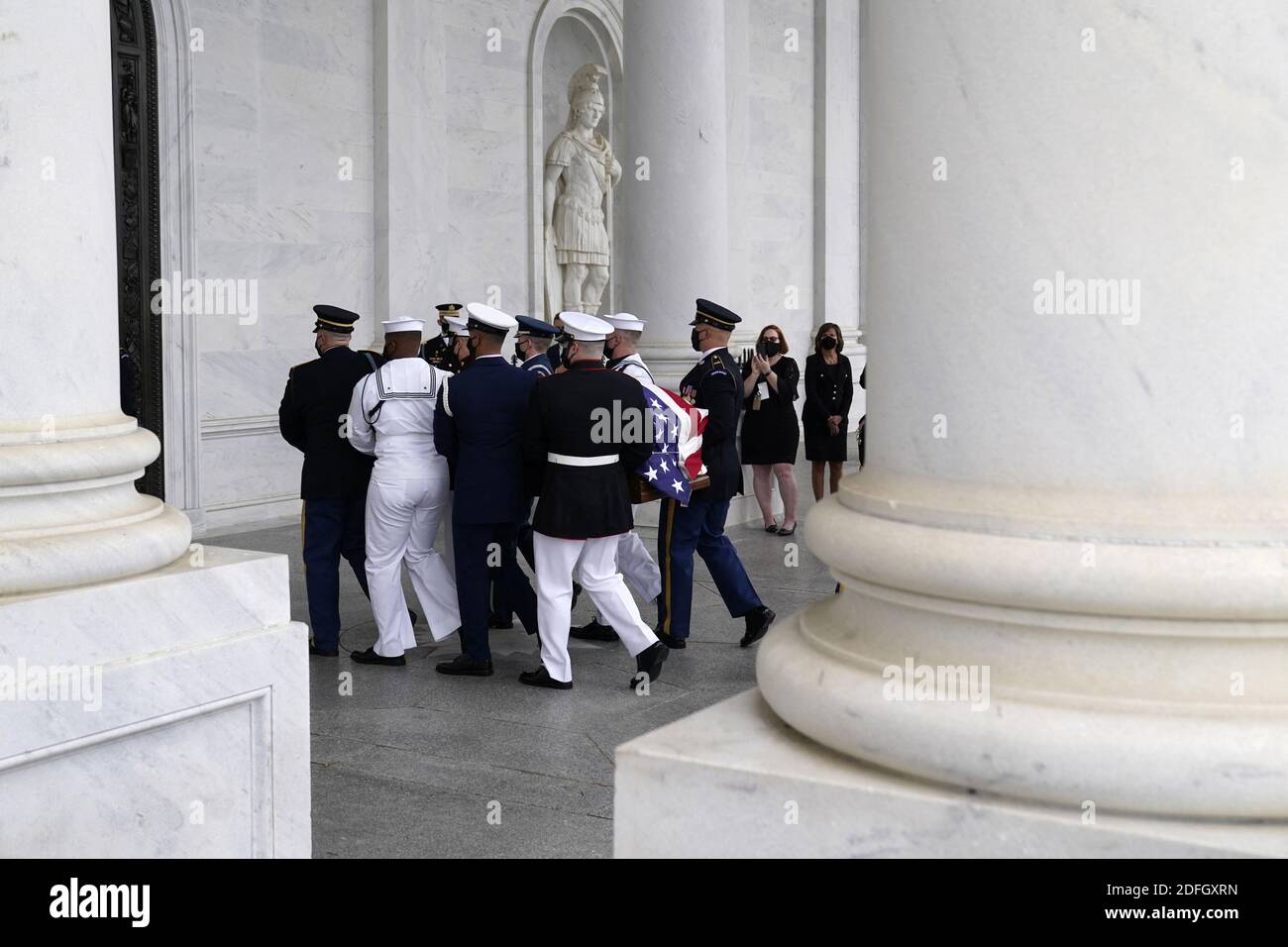 The flag-draped casket of Justice Ruth Bader Ginsburg is carried by a ...