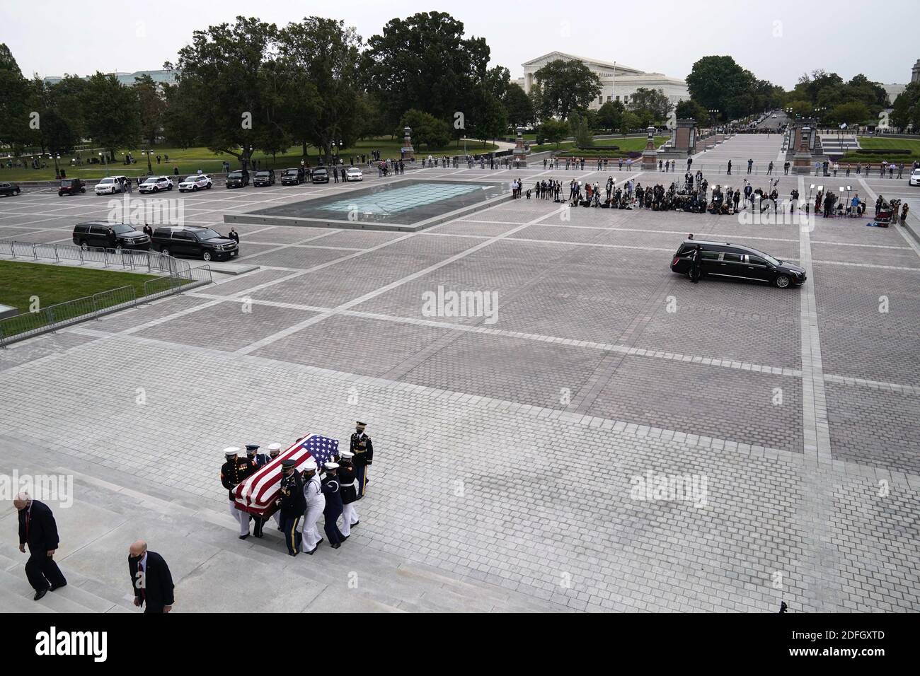 The flag-draped casket of Justice Ruth Bader Ginsburg is carried by a ...