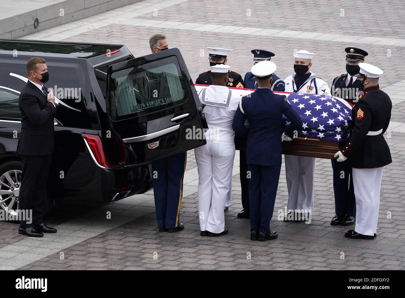 The flag-draped casket of Justice Ruth Bader Ginsburg is placed in a ...