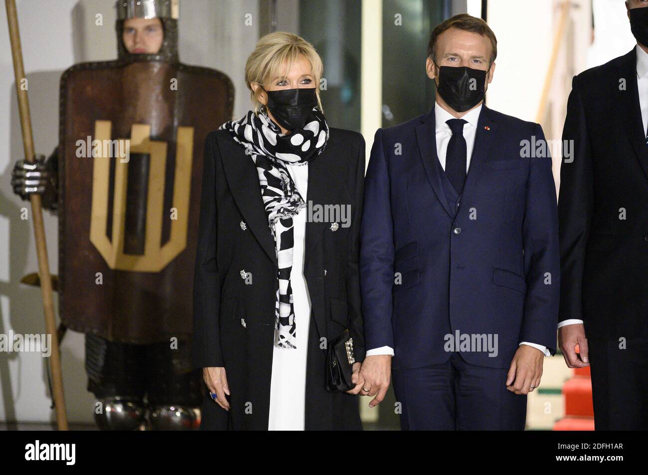 French President Emmanuel Macron and his wife Brigitte pose as they ...