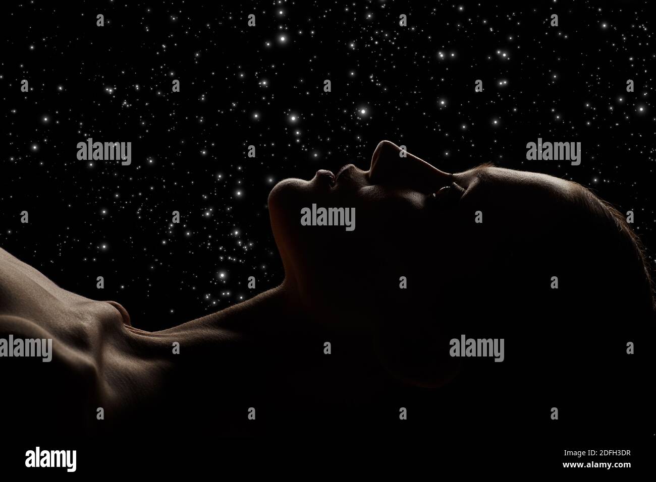 sad woman profile silhouette on stars background looking up Stock Photo ...
