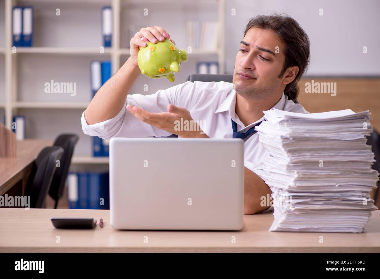 Young employee in remuneration concept Stock Photo - Alamy