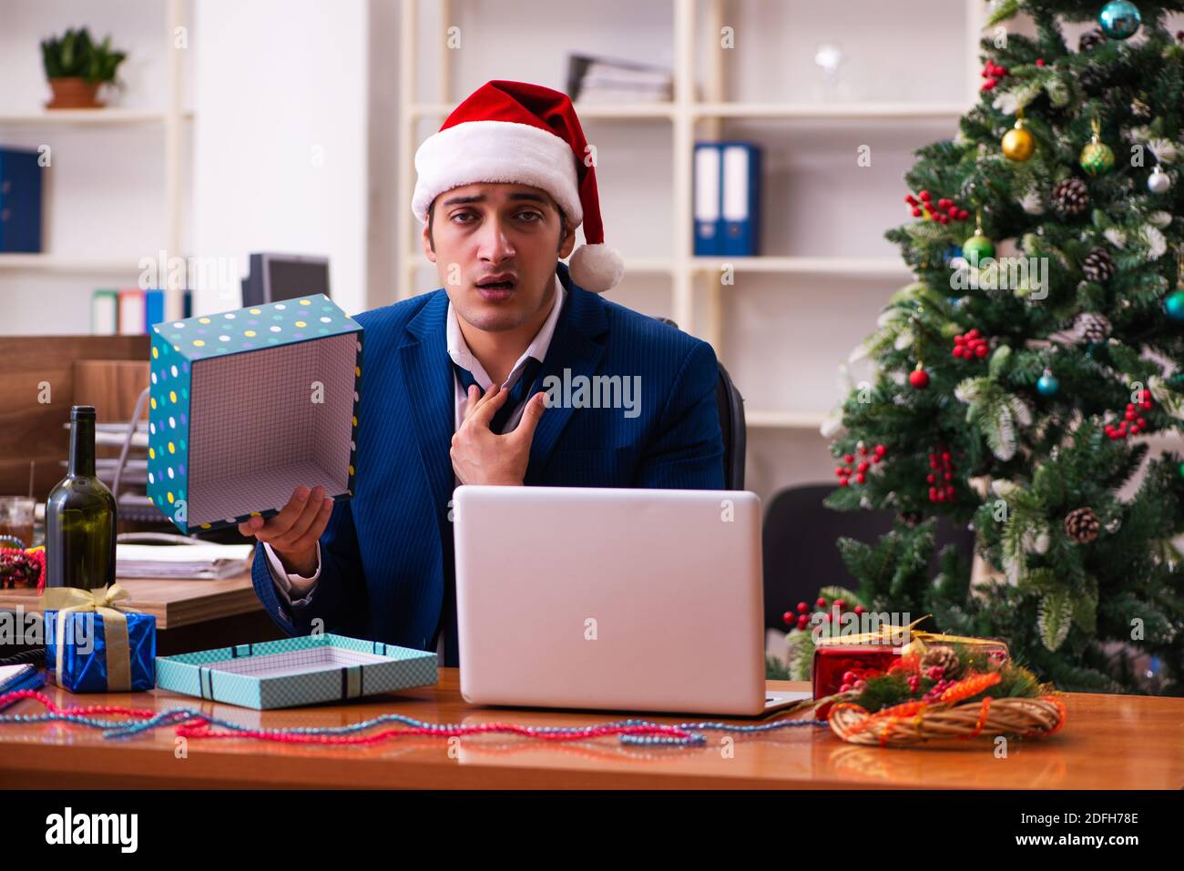 Employee in office during christmas party Stock Photo - Alamy