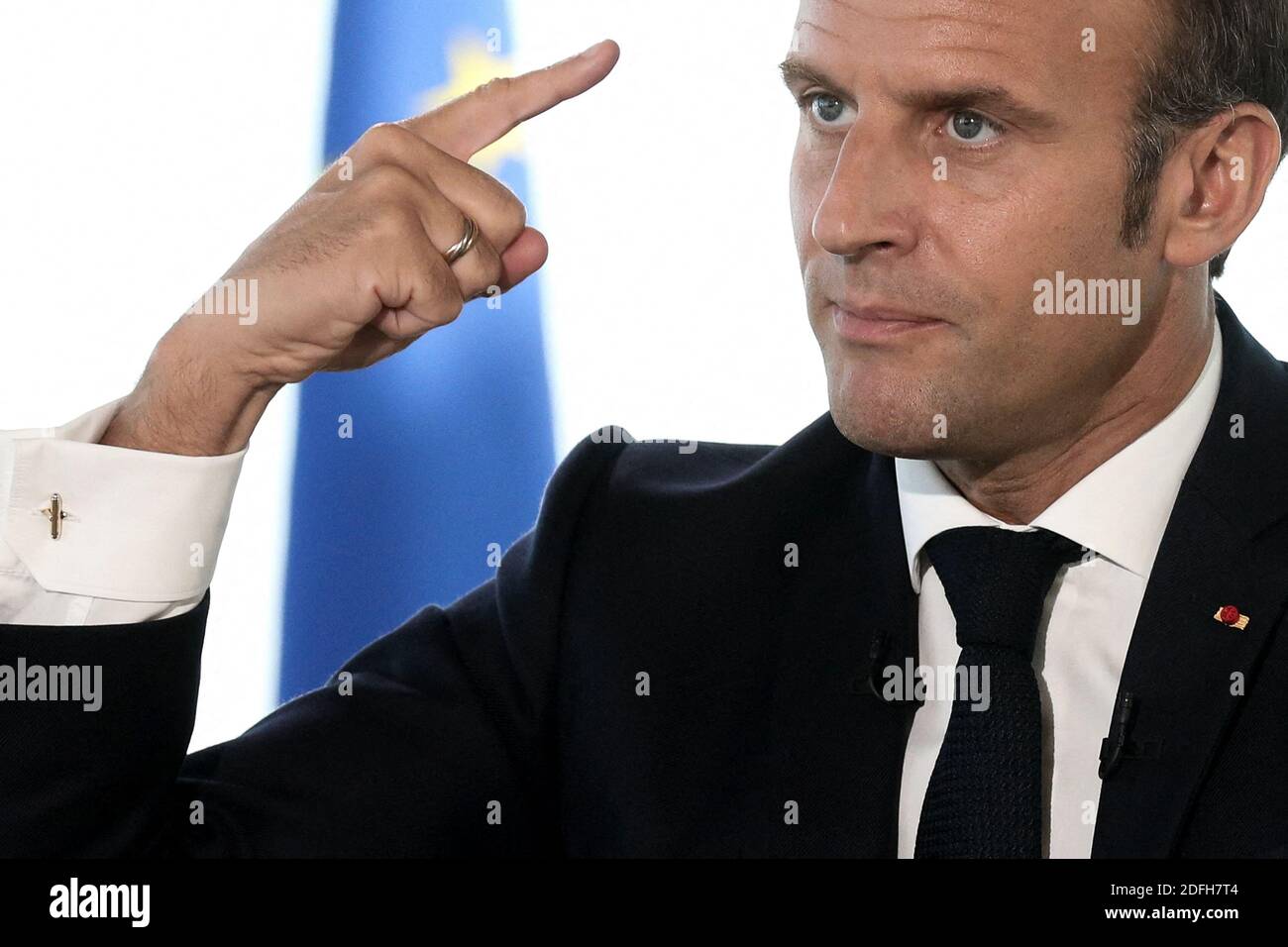 French President Emmanuel Macron takes part in a round table at the ...