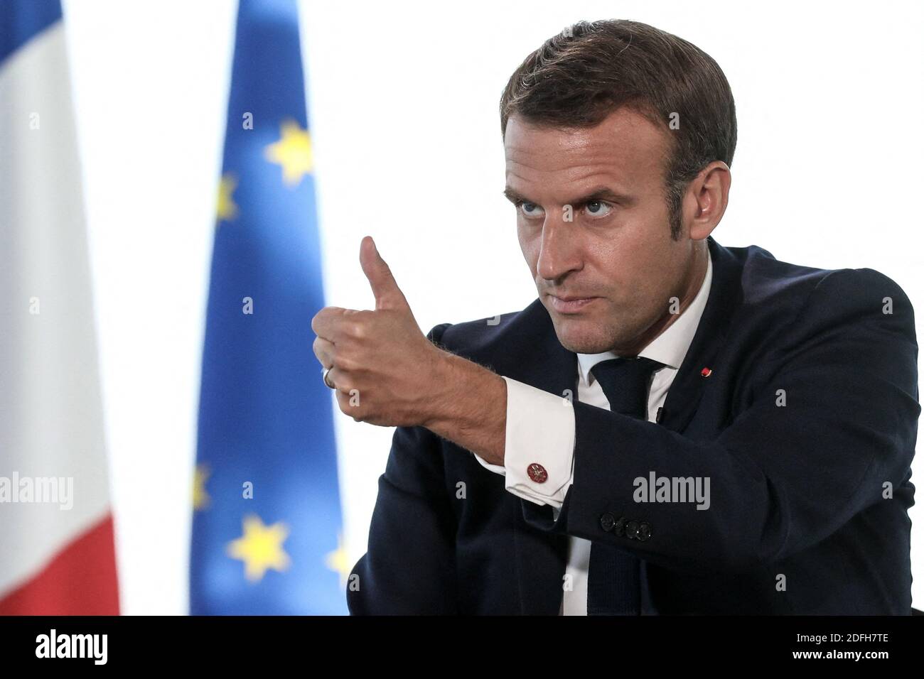 French President Emmanuel Macron takes part in a round table at the ...