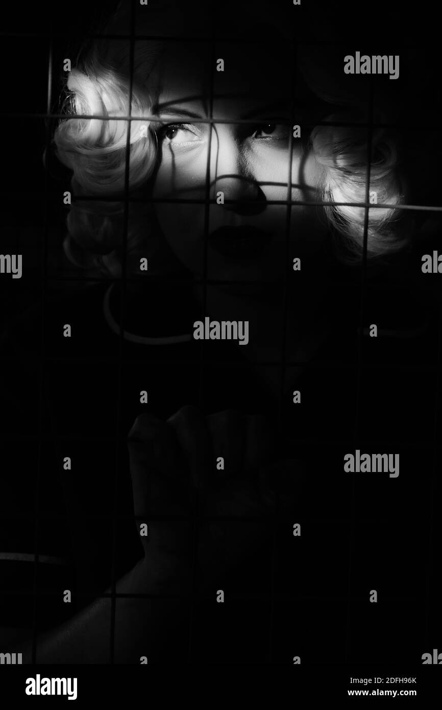 sad scared blonde behind bars close up portrait, monochrome Stock Photo ...