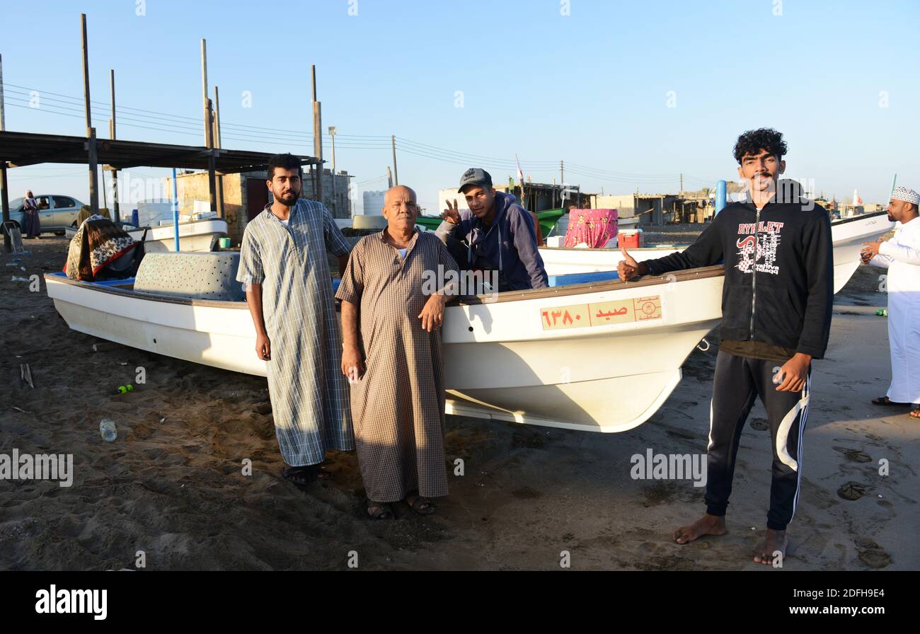 Omani fishermen by their fishing boat in Barka, Oman Stock Photo - Alamy
