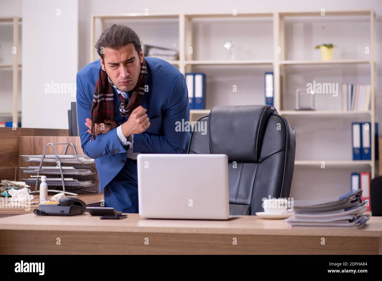Sick businessman employee suffering at workplace Stock Photo - Alamy