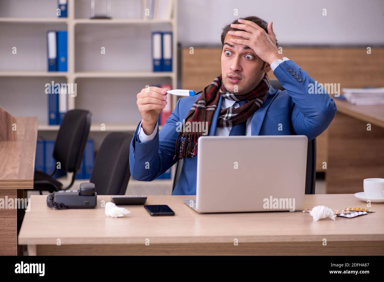 Sick businessman employee suffering at workplace Stock Photo - Alamy