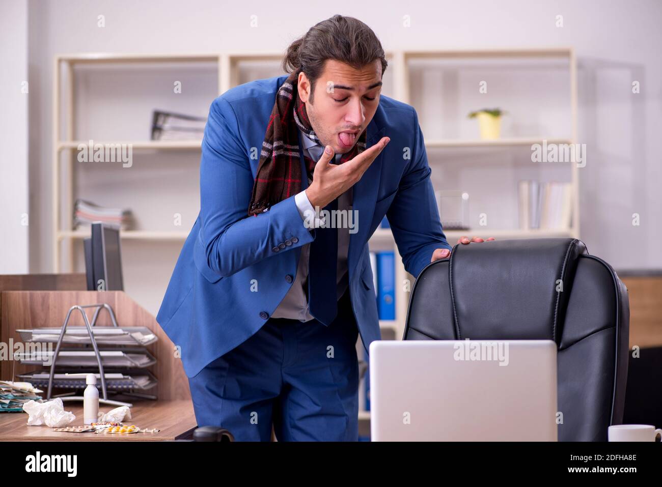Sick businessman employee suffering at workplace Stock Photo - Alamy