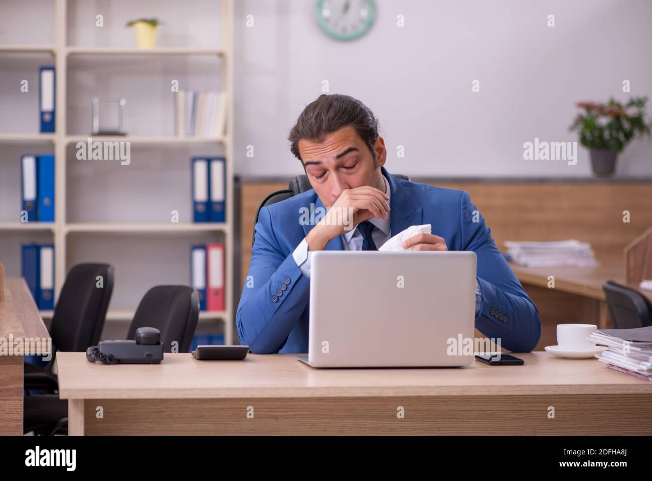 Sick businessman employee suffering at workplace Stock Photo - Alamy