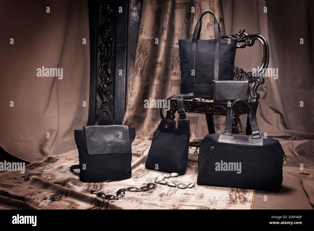 collection of black leather bags are placed in studio Stock Photo - Alamy