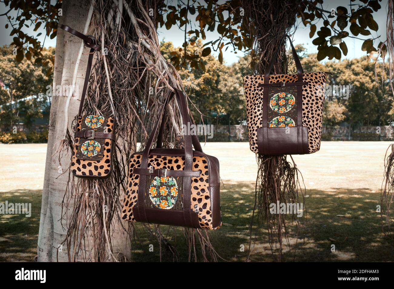 collection of indian design bags hang on tree Stock Photo - Alamy