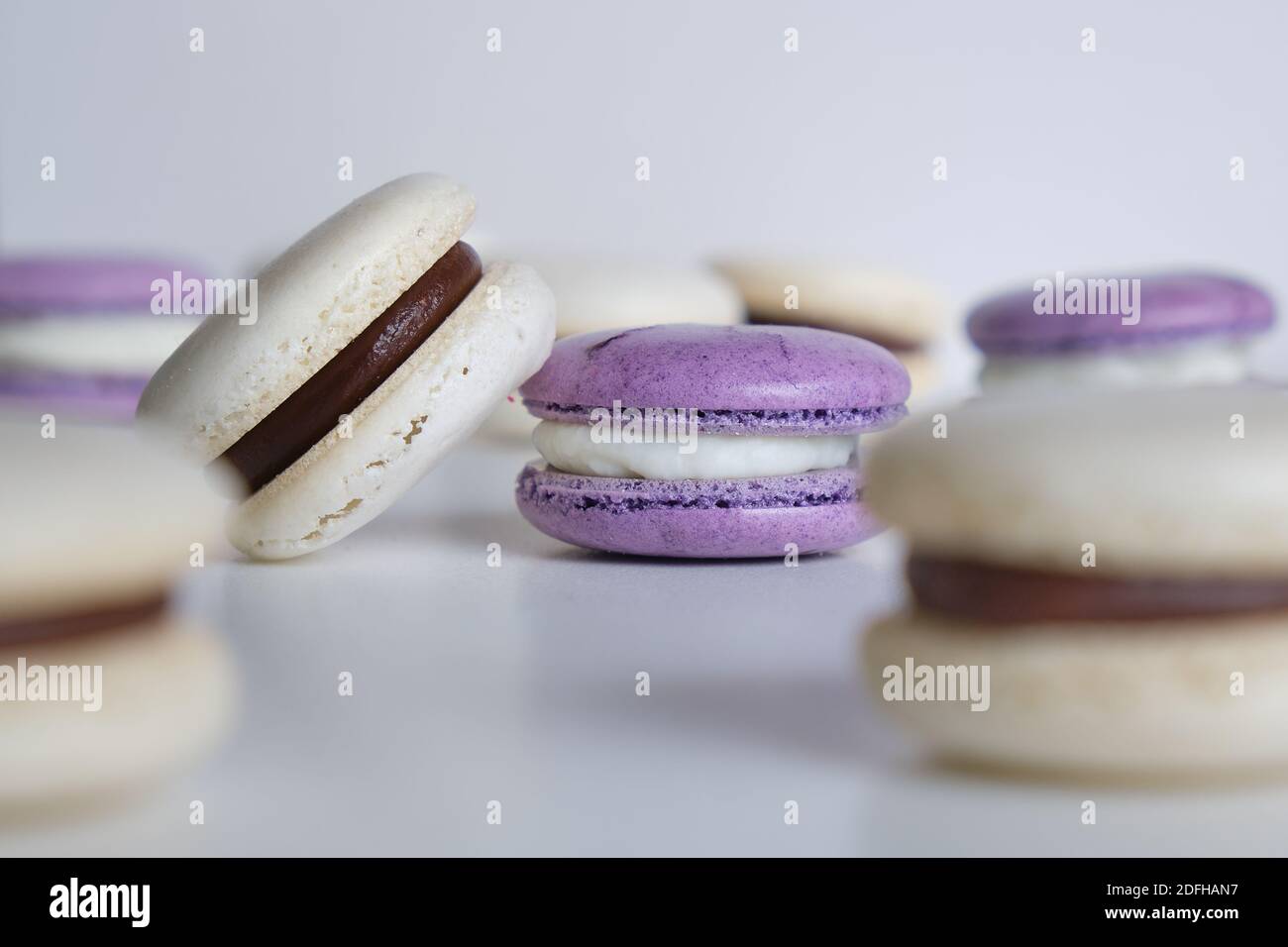 photo of pastel purple and white macaroons, filled with white chocolate ...
