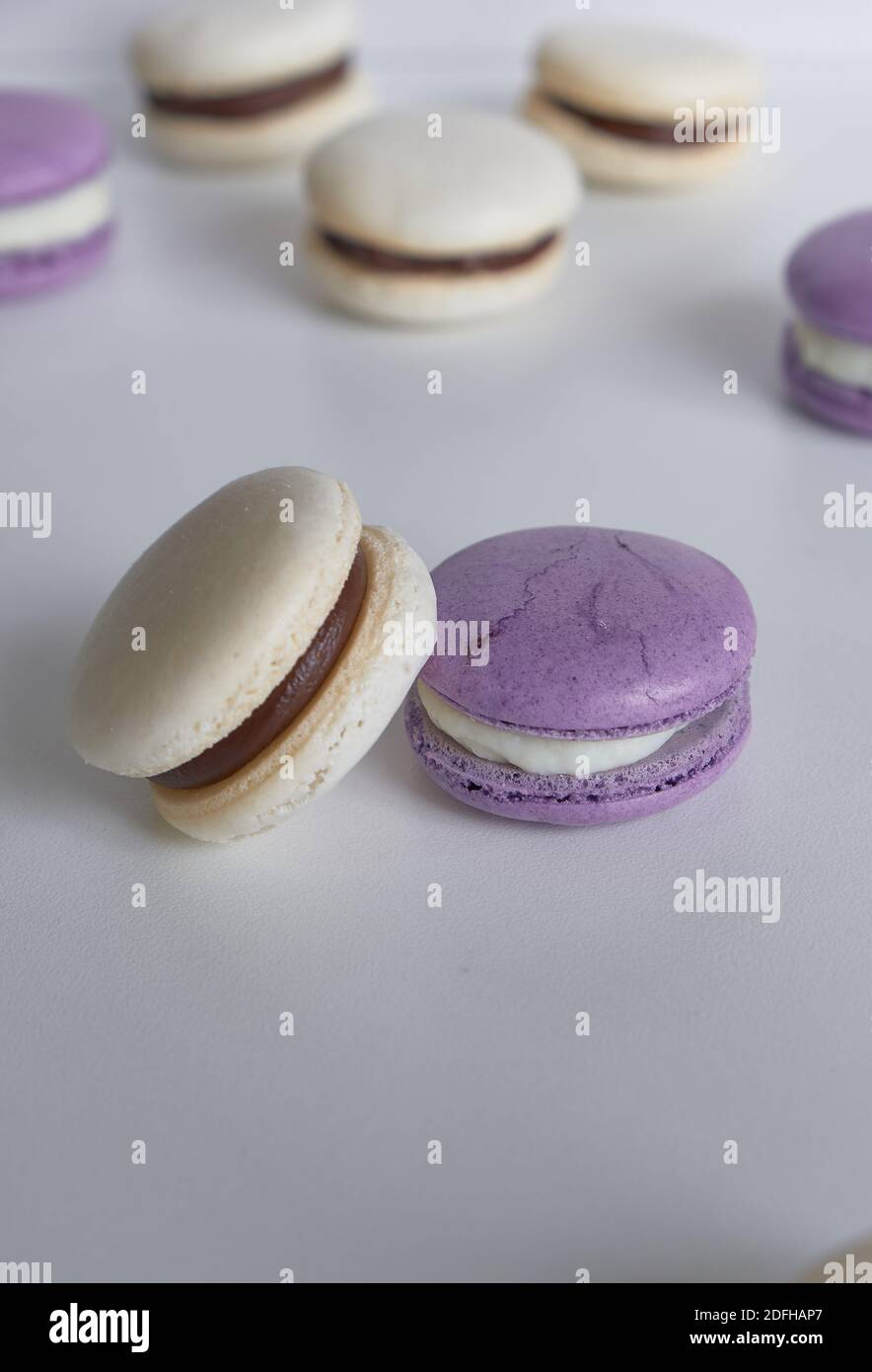 photo of pastel purple and white macaroons, filled with white chocolate ...