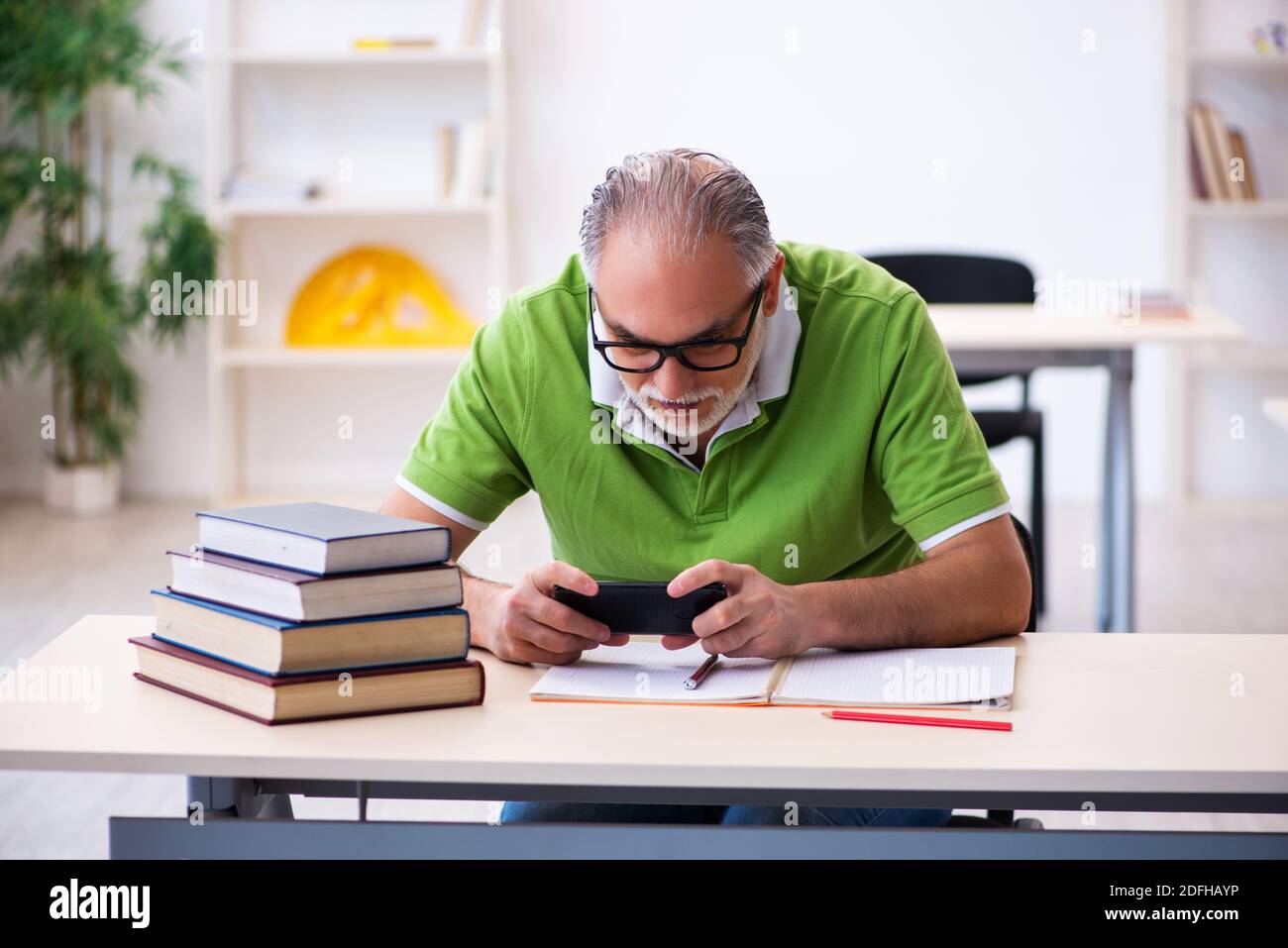 Senior male student preparing for exams in the classroom Stock Photo ...